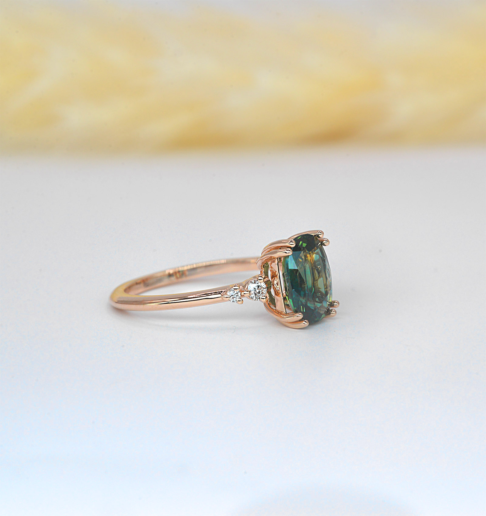 Ring in rose gold - featuring oval teal sapphire - DIORAH JEWELLERS